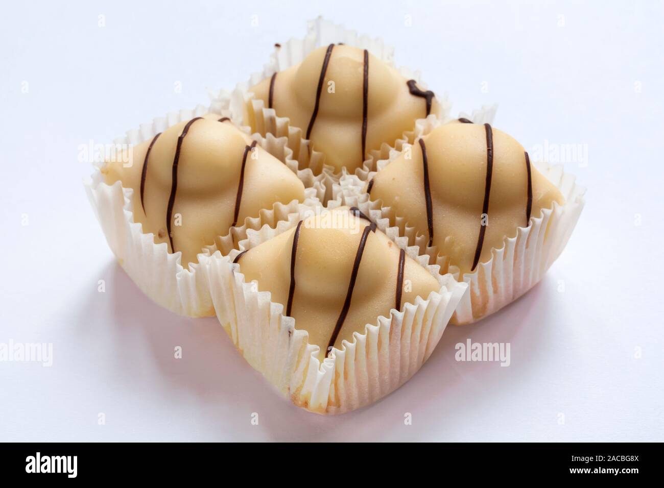 Golden sponge cakes with a vanilla flavour topping hi-res stock ...
