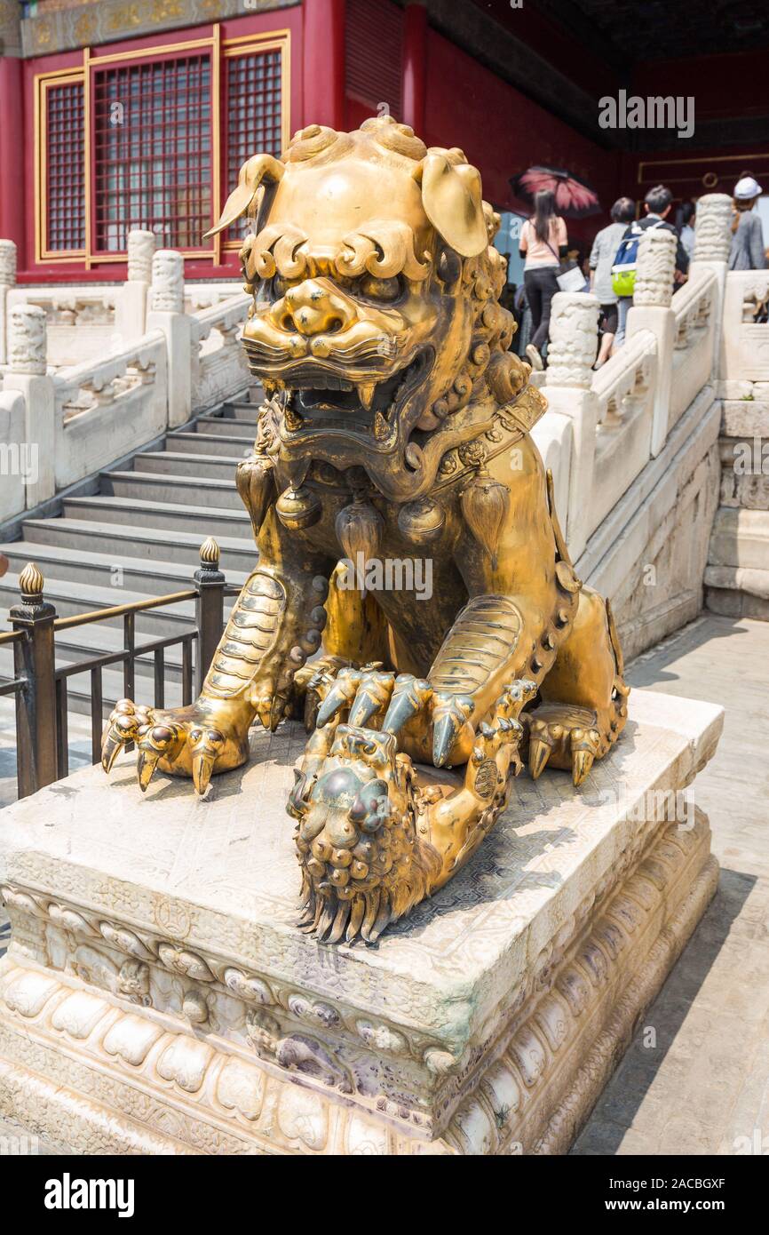 Chinese bronze qilin statue next to the white stone stairs Stock Photo ...