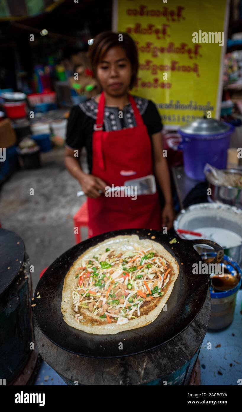 Yangon, Myanmar. December 24, 2018: An unidentified Burmese woman ...
