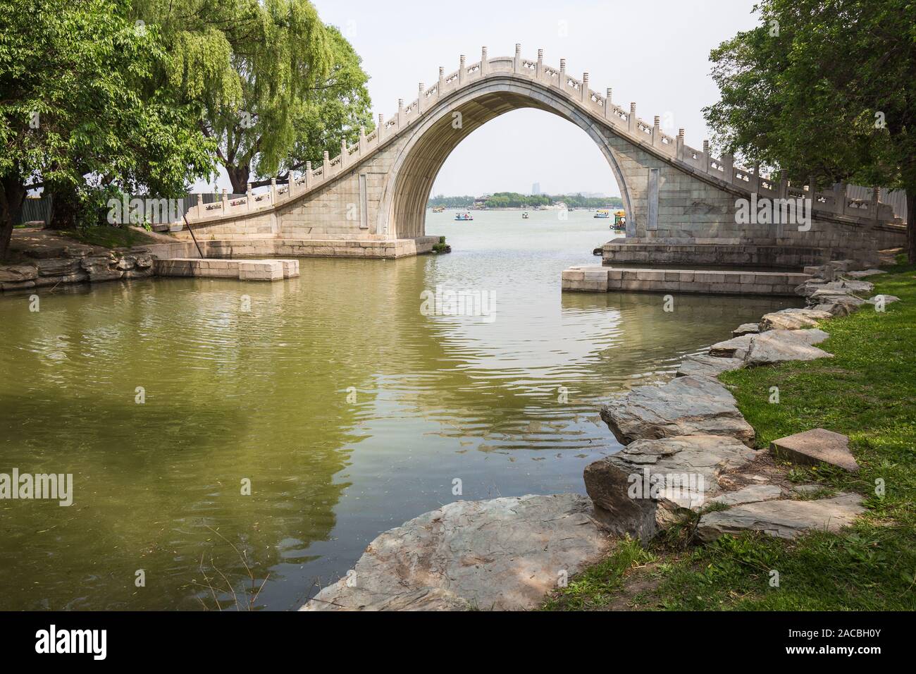 A Moon Gate Bridge - highly-rounded arched pedestrian bridge. The high ...