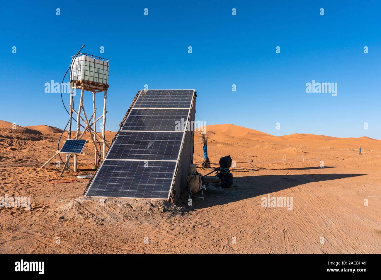 Solar energy panel and water tank in the desert. Sun as energy resource ...