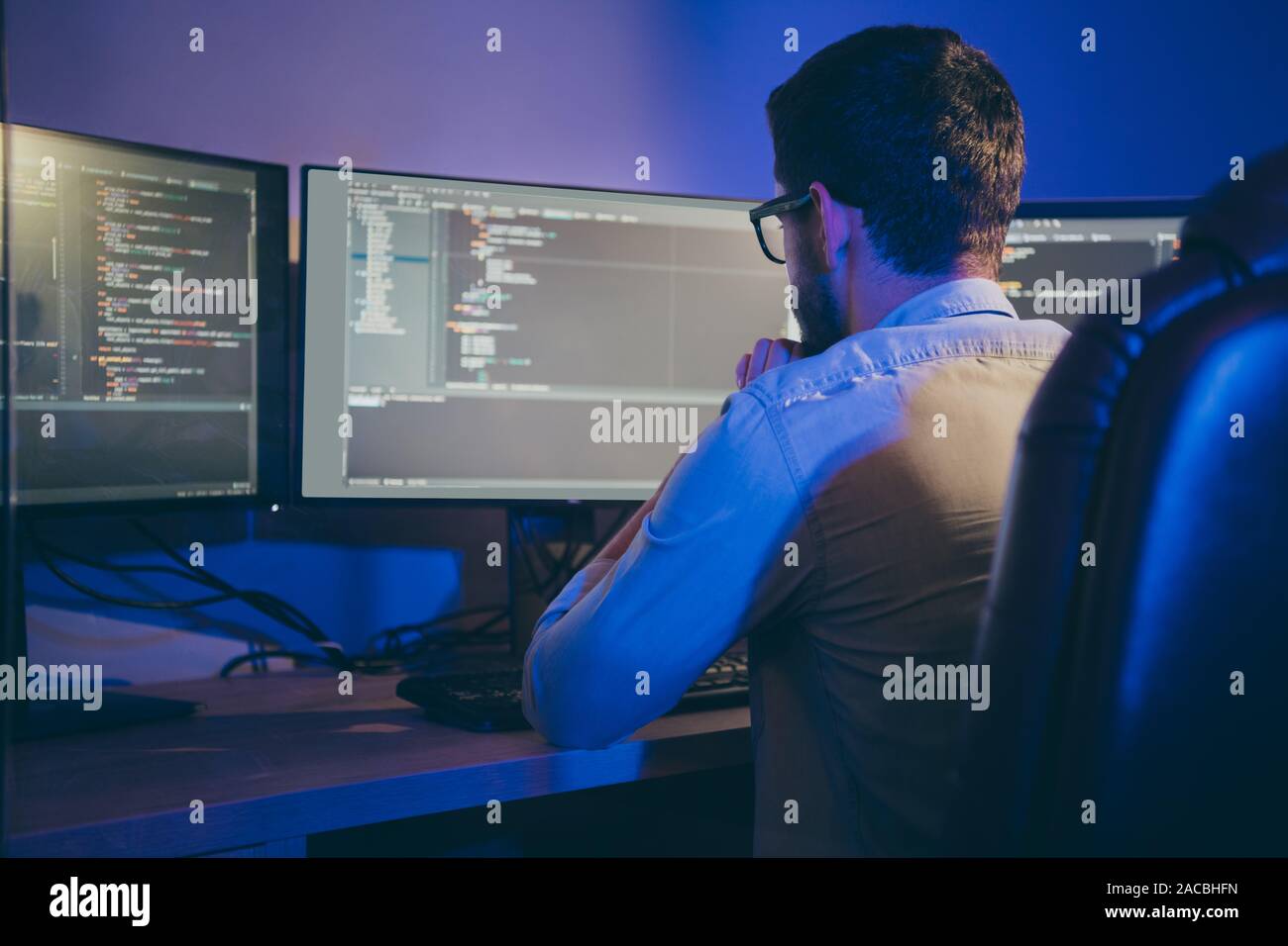 Rear back behind view portrait of nice focused skilled experienced guy ...