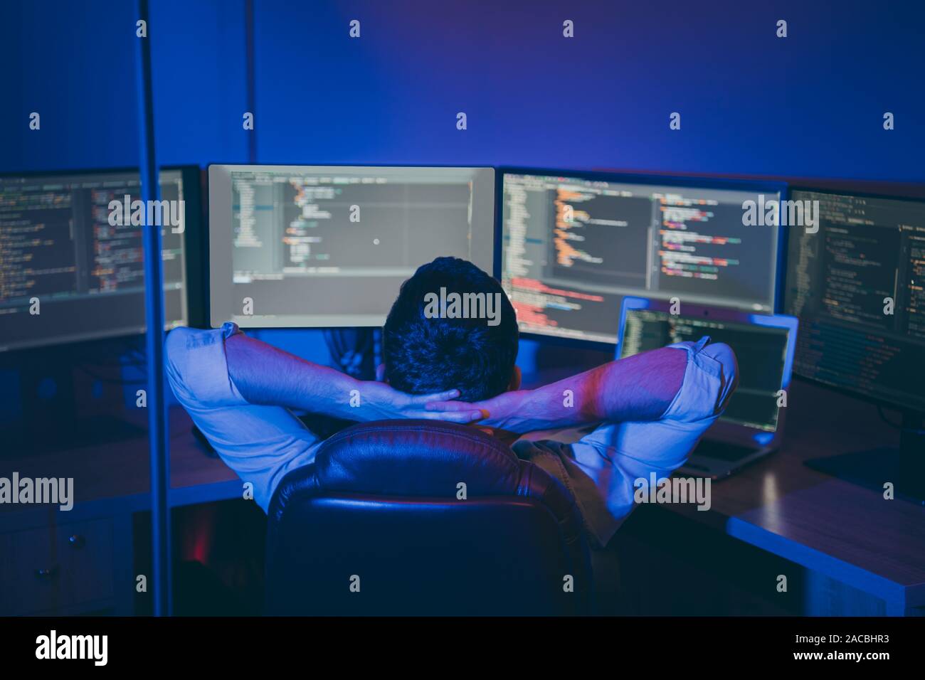 Rear behind view photo of it skilled specialist guy sitting comfy ...