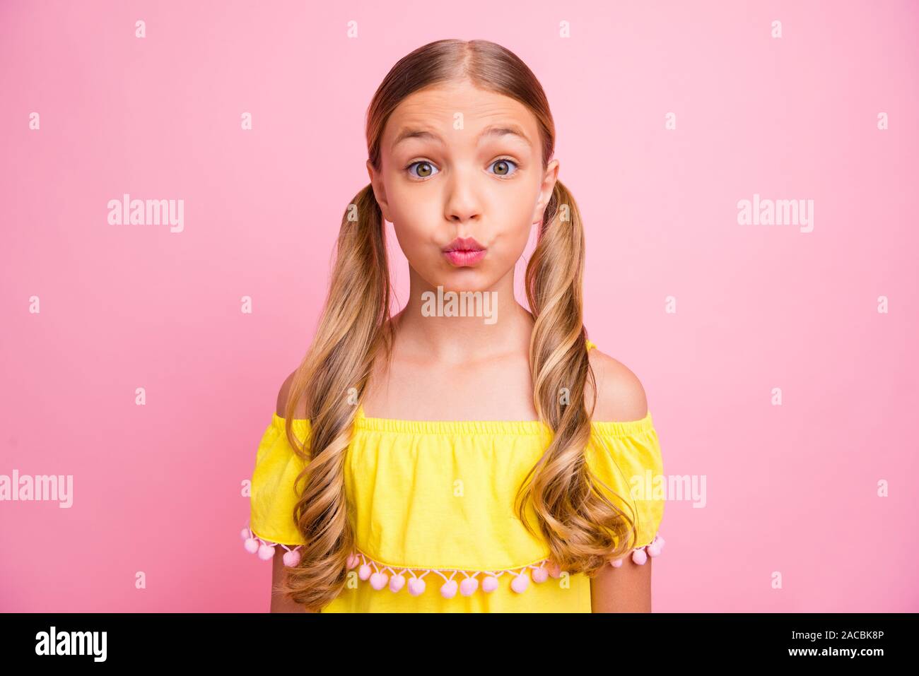 Photo of beautiful little lady sending air kisses to classmate boy ...