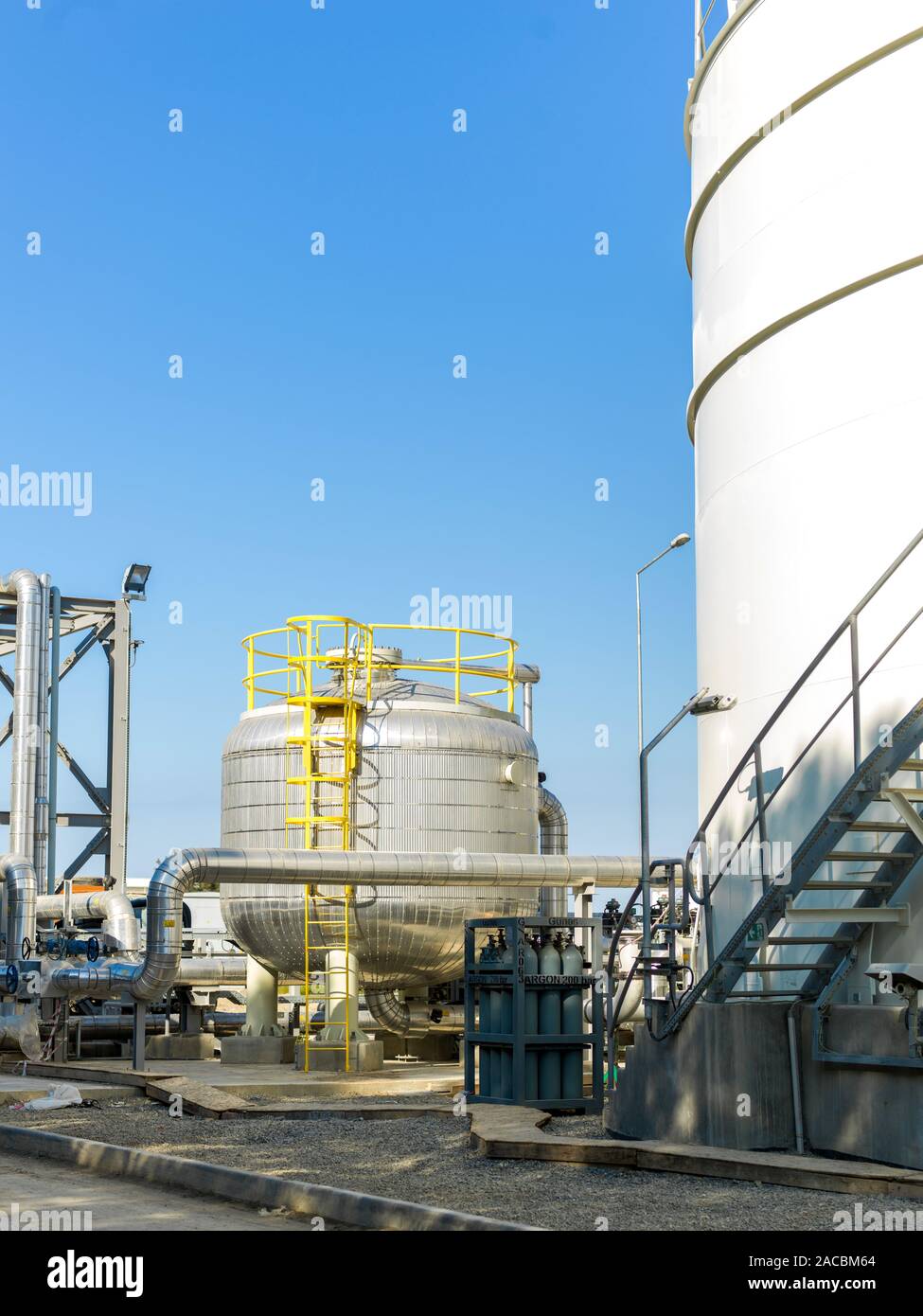 oil and gas processing tank and pipes Stock Photo - Alamy