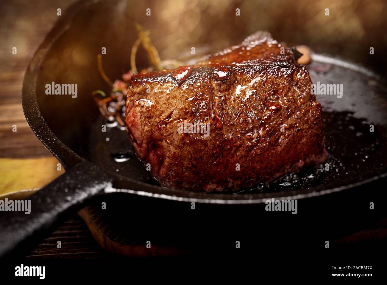 Beef steak fried in a pan Stock Photo - Alamy