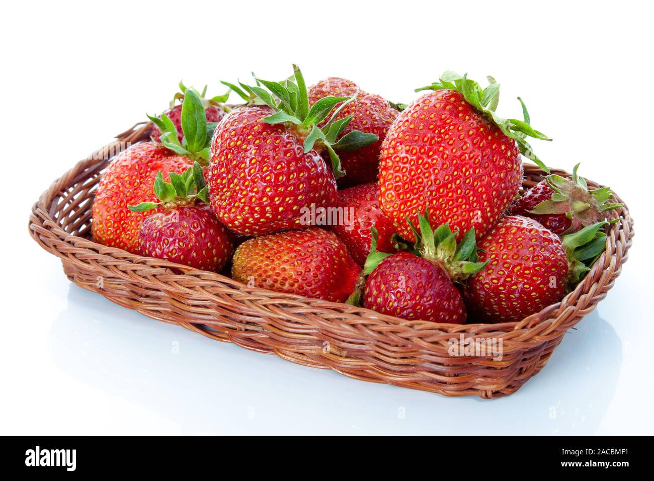 Strawberries in a basket isolated on white background Stock Photo - Alamy