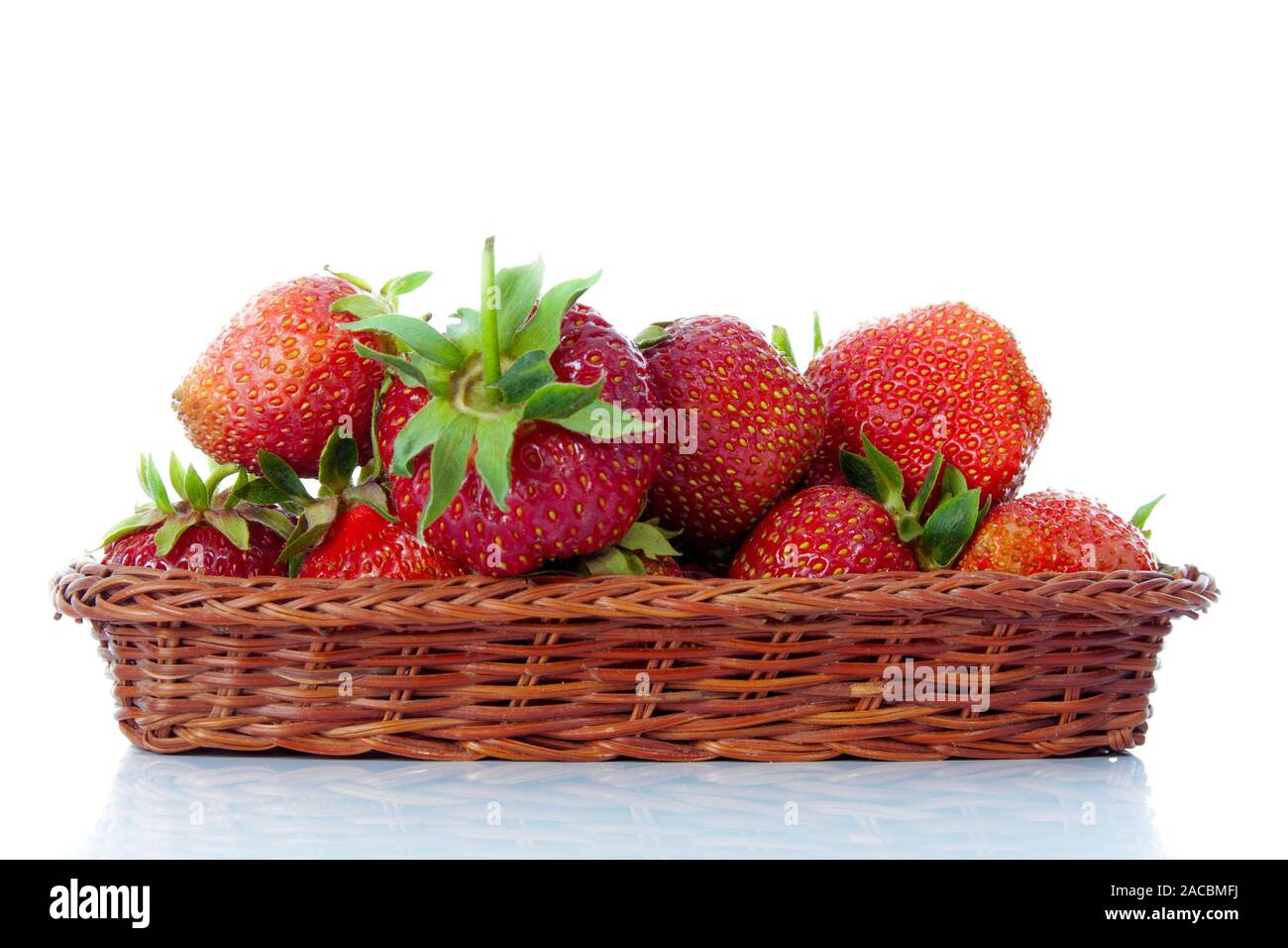 Strawberries in a basket isolated on white background Stock Photo - Alamy