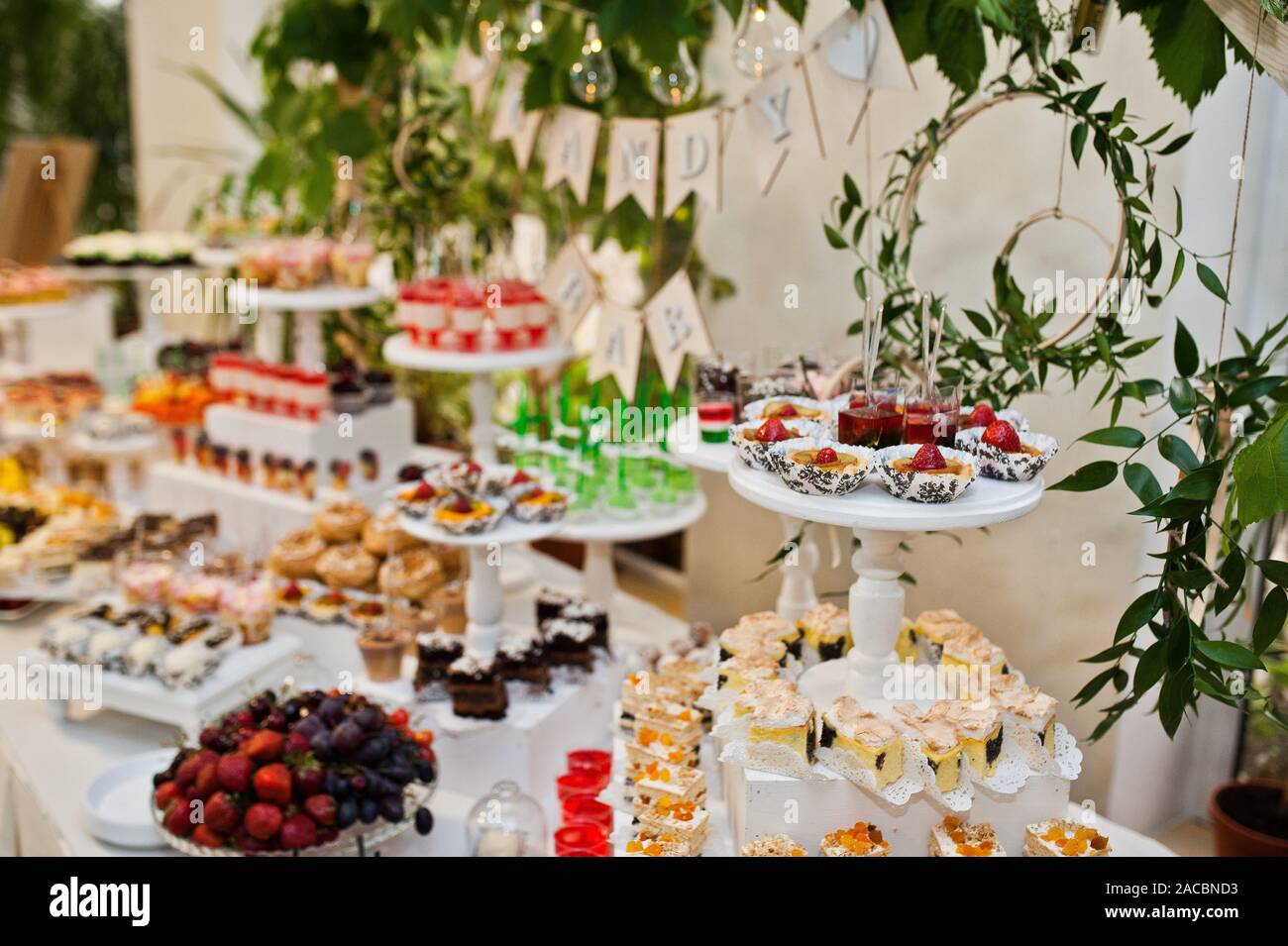 Dessert table of delicious sweets on wedding reception Stock Photo - Alamy