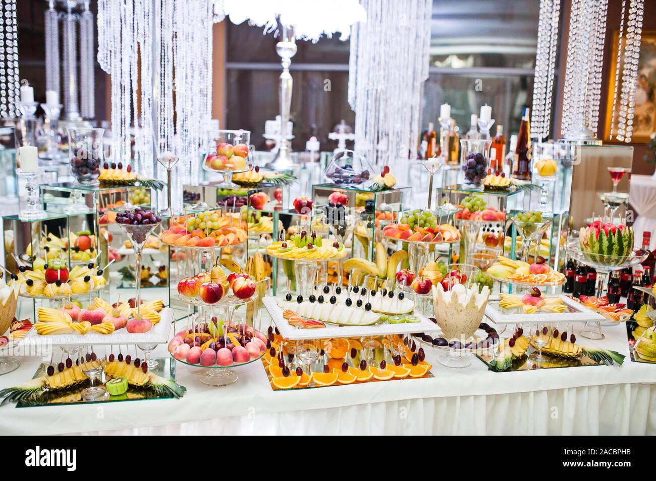 Dessert table of delicious sweets on wedding reception Stock Photo - Alamy
