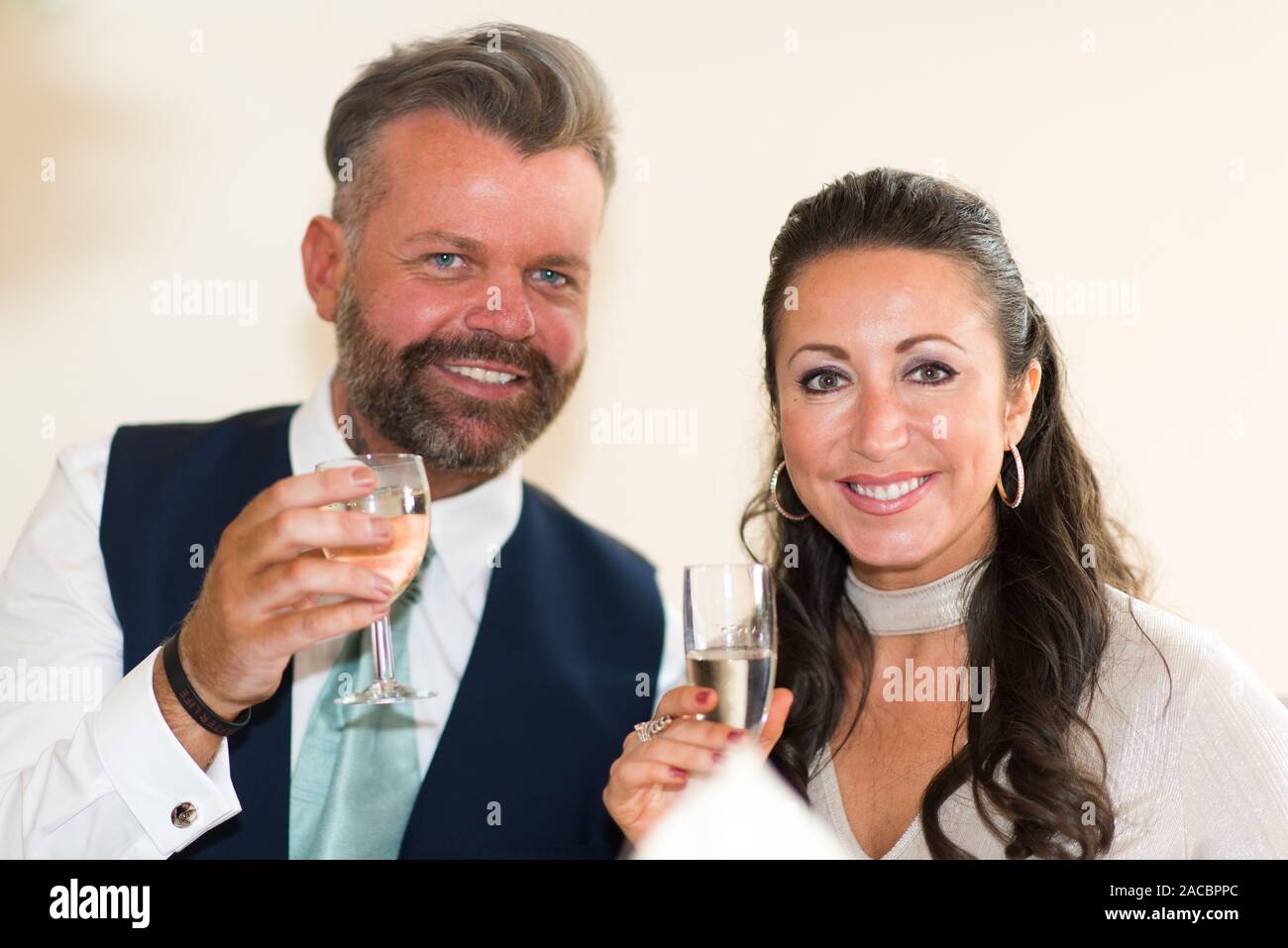 Happy, smiling wedding guests at the after ceremony, wedding breakfast ...
