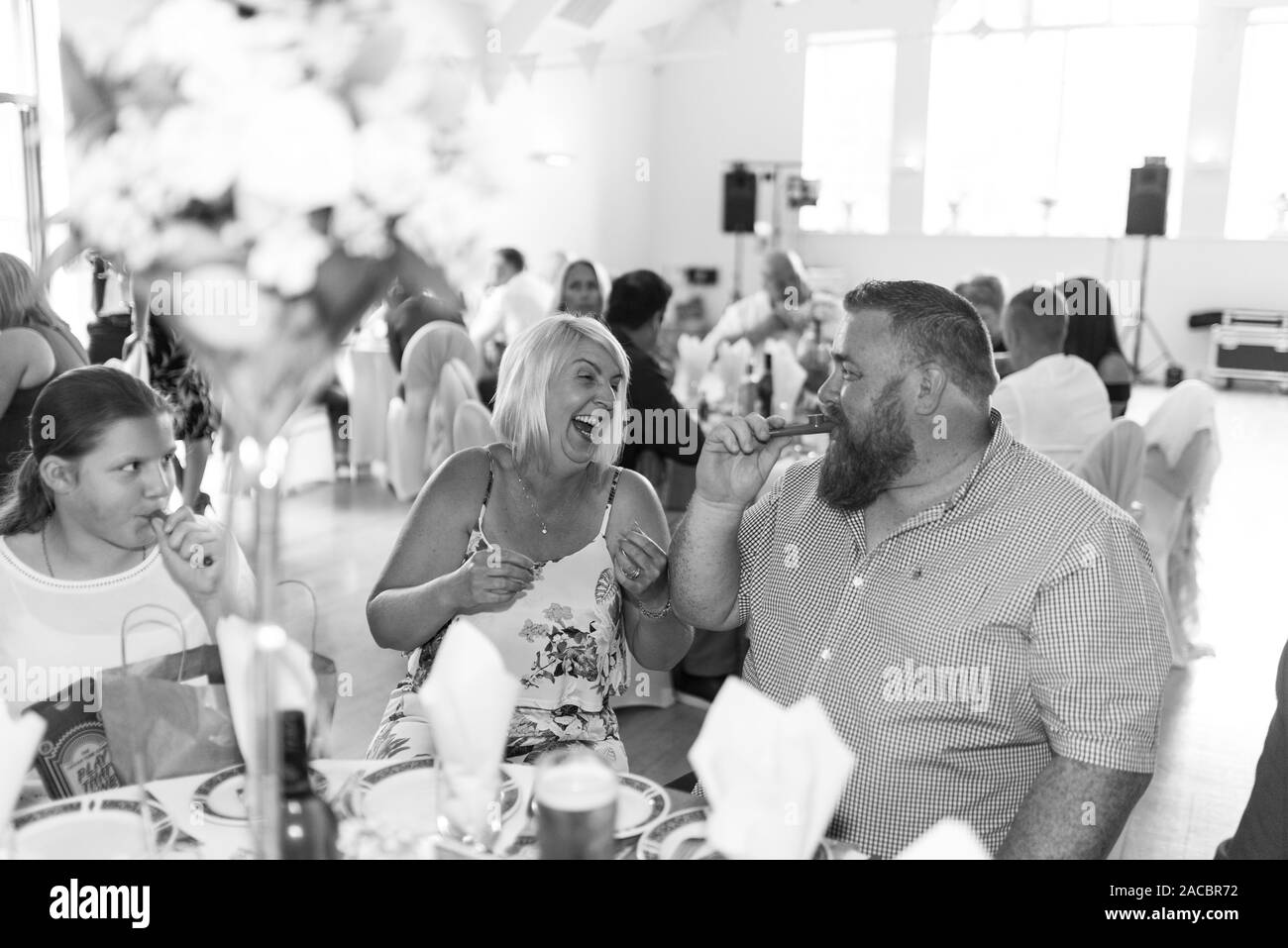 Happy, smiling wedding guests at the after ceremony, wedding breakfast ...