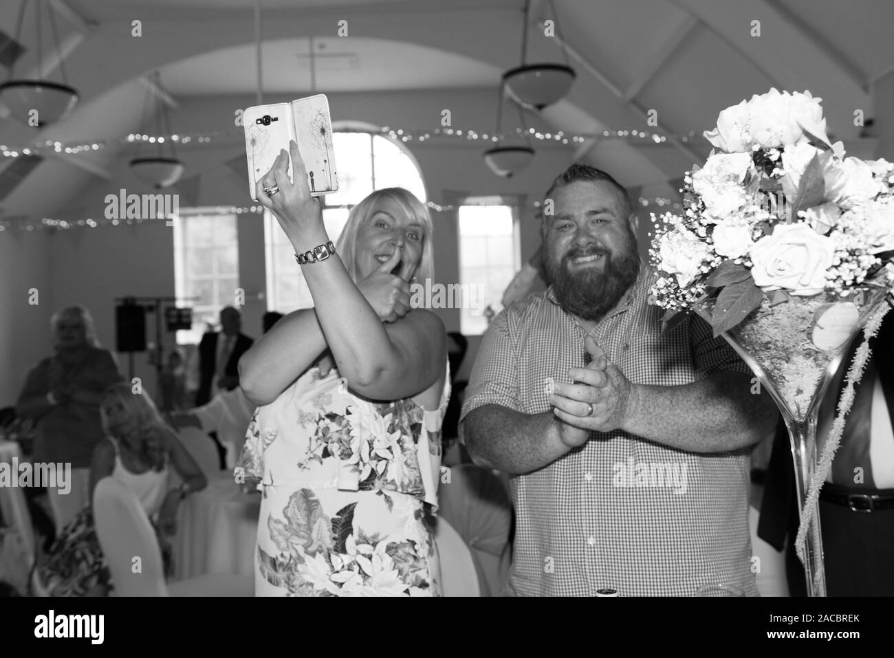 Happy, smiling wedding guests at the after ceremony, wedding breakfast ...