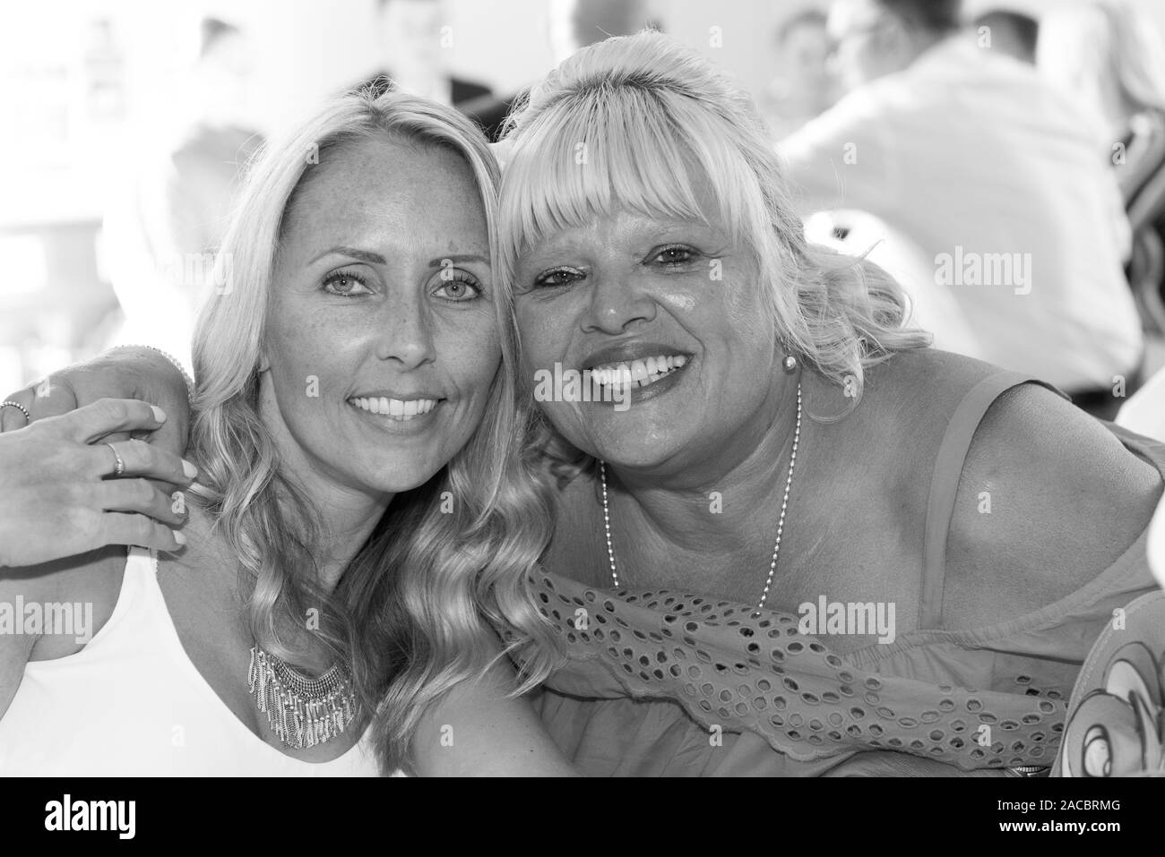 Happy, smiling wedding guests at the after ceremony, wedding breakfast ...