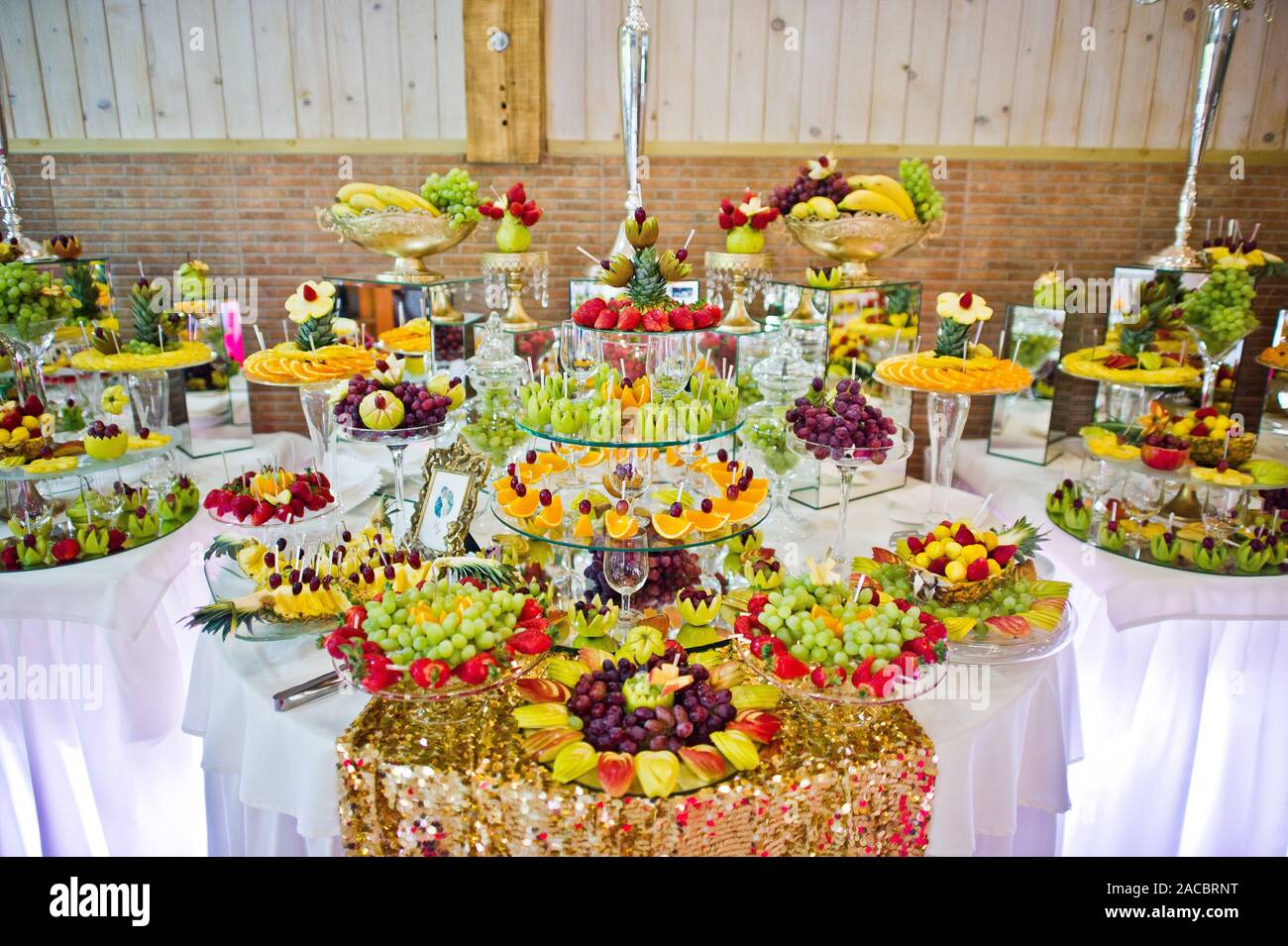 Dessert table of delicious fruits on wedding reception Stock Photo - Alamy
