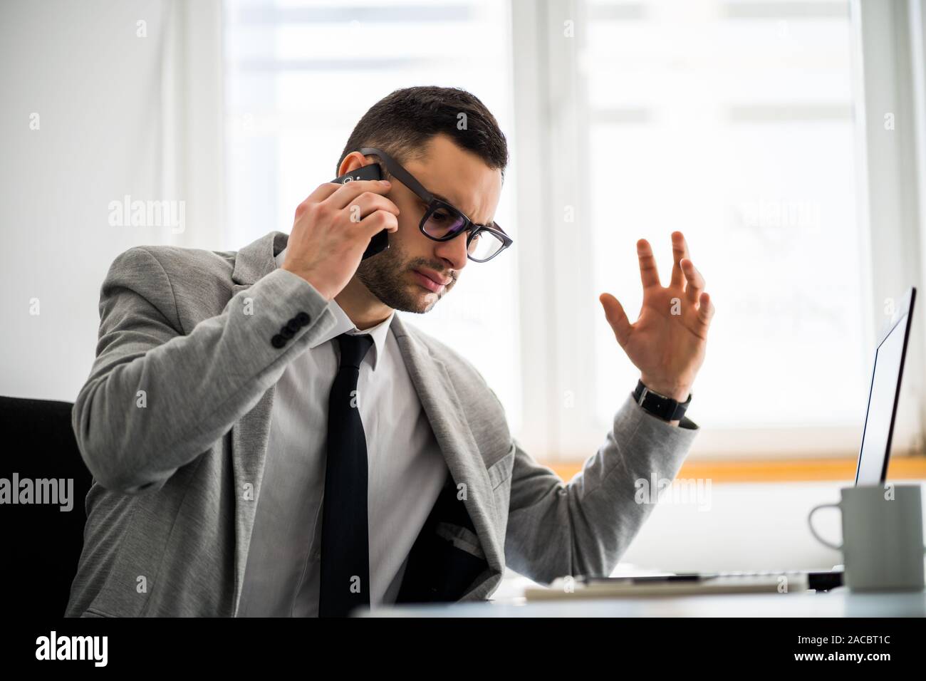 Angry furious businessman working on hi-res stock photography and ...