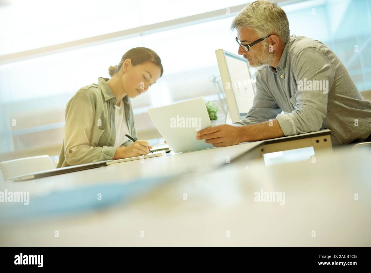 Informal business meeting between work colleagues Stock Photo - Alamy
