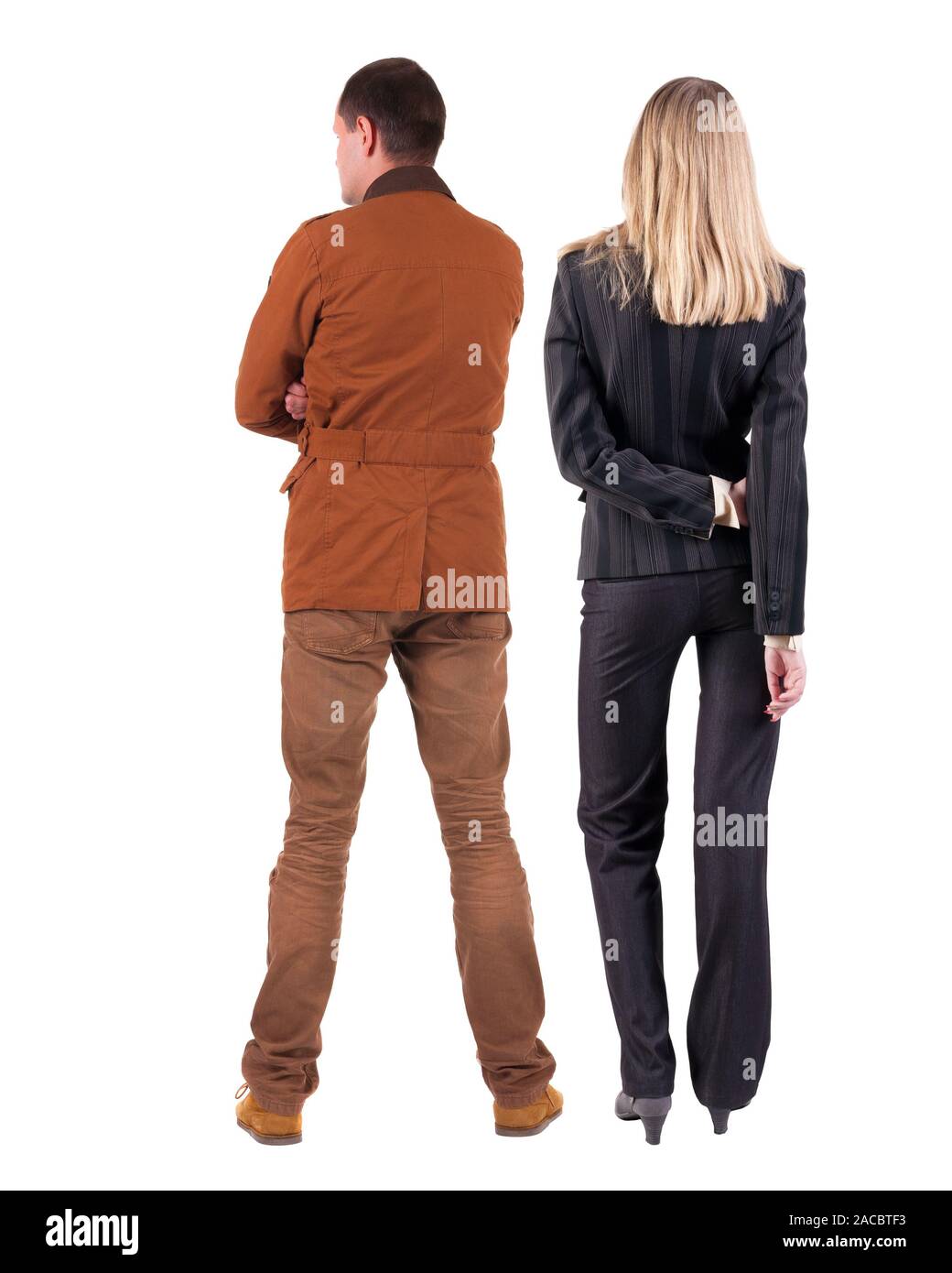 Back view of couple. beautiful friendly girl and guy together. Rear ...