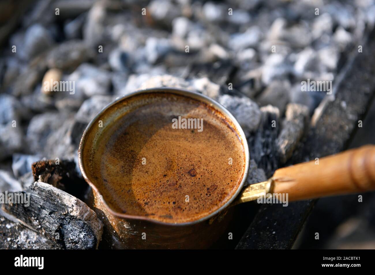 Turkish coffee pot on embers. Sparkling turkish coffee making Stock ...