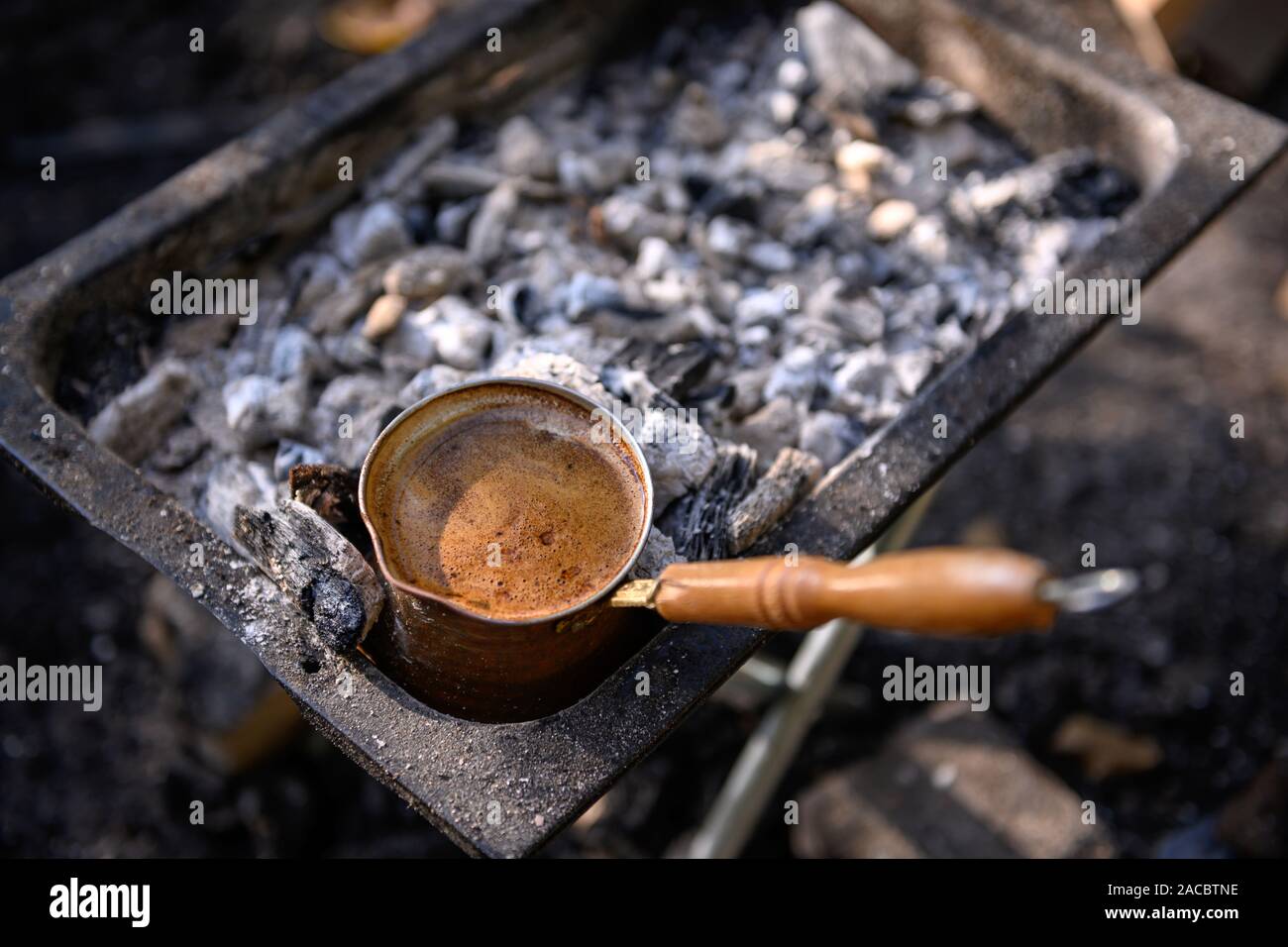 Turkish coffee pot on embers. Sparkling turkish coffee making Stock ...