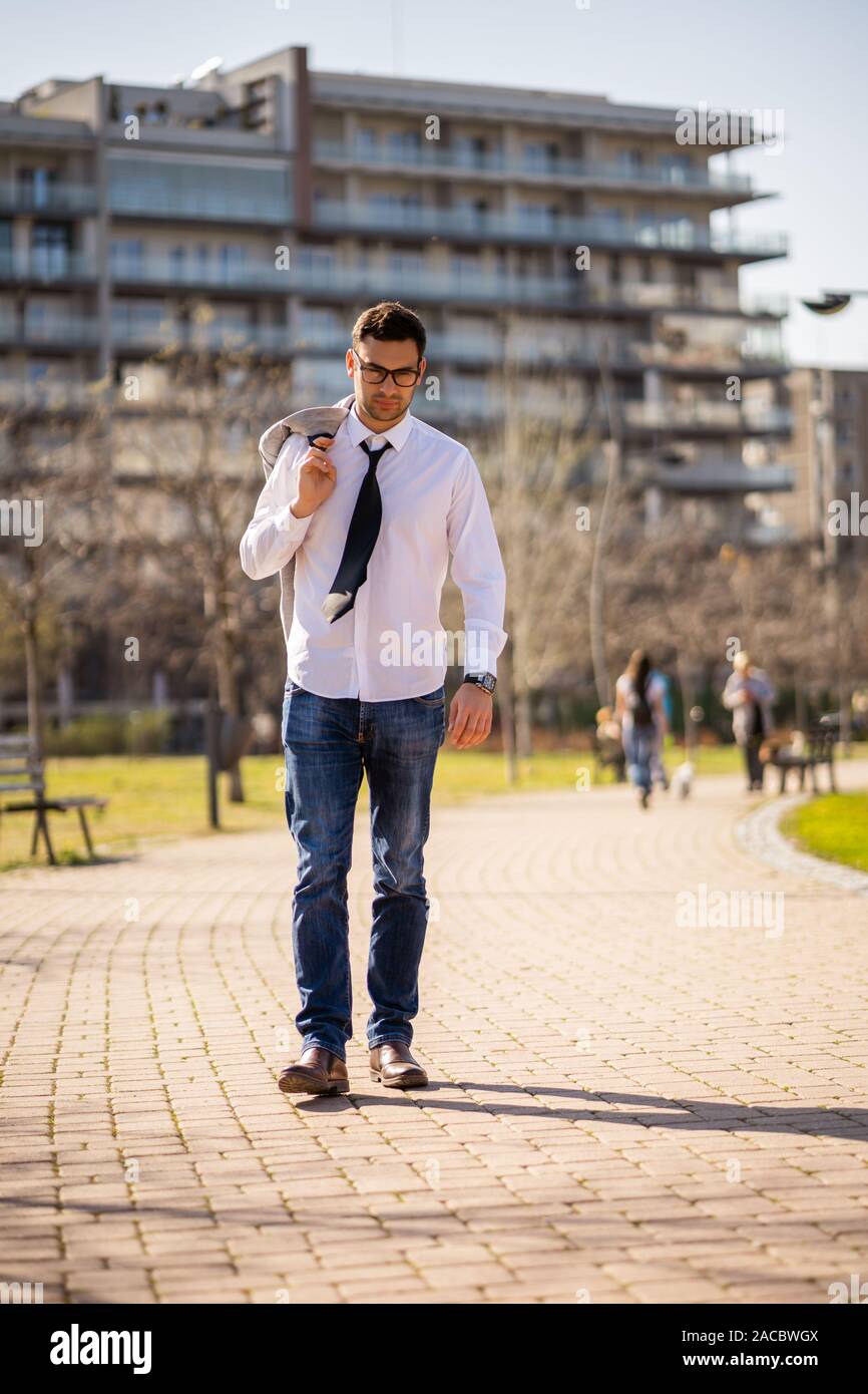 Young tired businessman is going home from work Stock Photo - Alamy