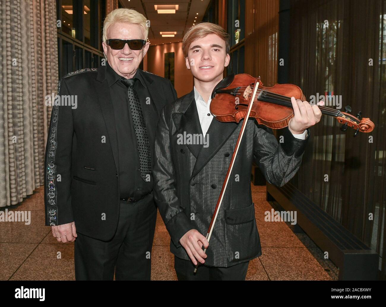 02 December 2019, Berlin: The singer Heino (l) and the violinist Yury ...