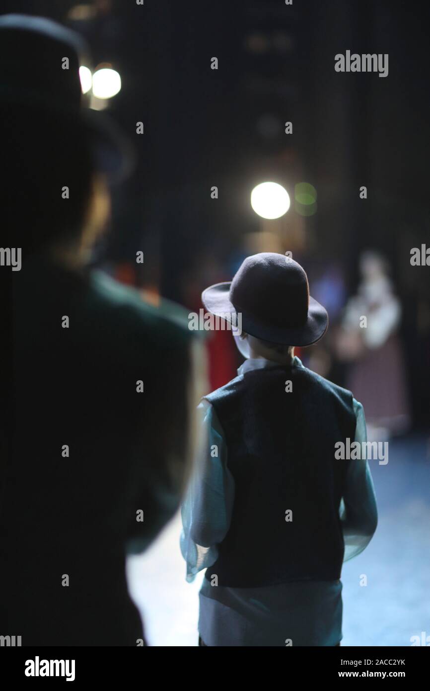 Young dancer in costume behind the scenes in anticipation of going on ...
