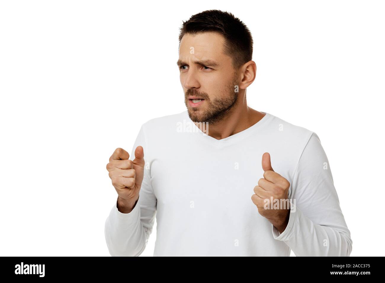 portrait of scared bearded man in casual white shirt isolated on white ...