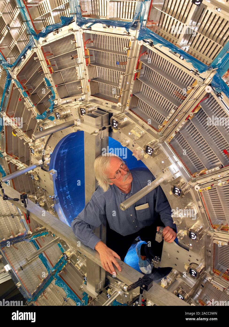 ALICE detector. Engineer inspecting part of the ALICE (a large ion ...