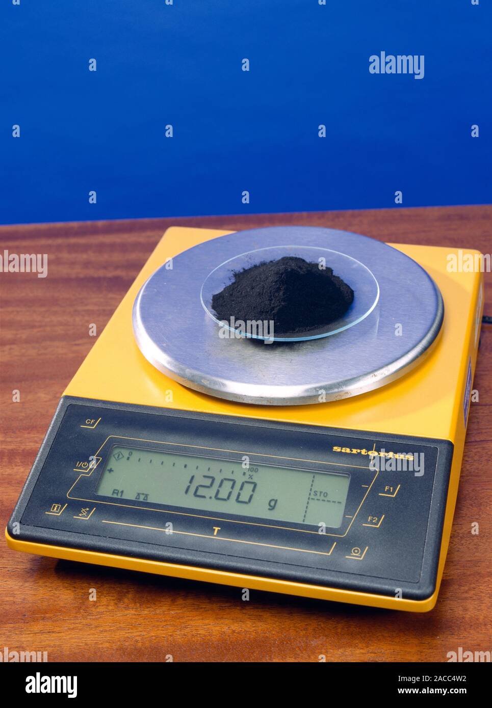 One mole of carbon. Carbon powder being weighed out on a balance. 12 ...
