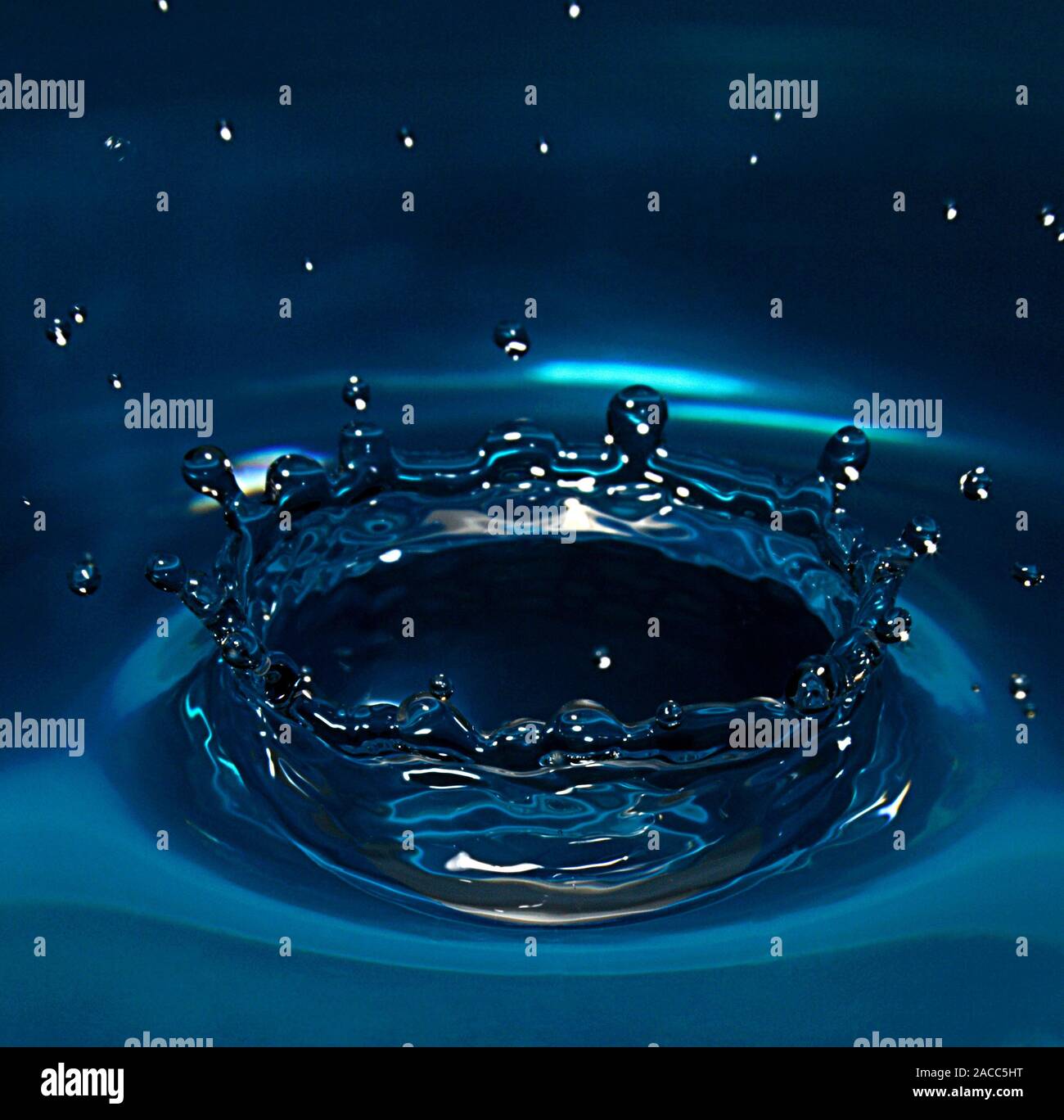 Water drop impact on water surface Stock Photo - Alamy