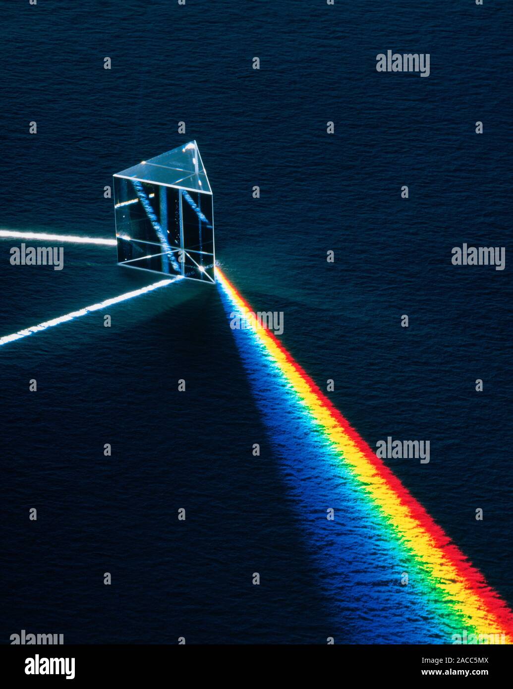 A prism demonstrating refraction and reflection effects. A beam of ...