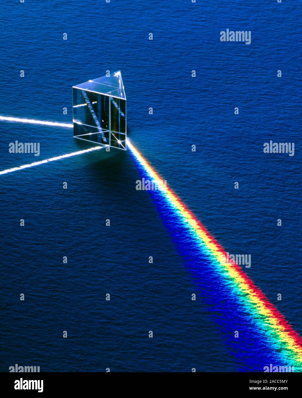 A prism demonstrating refraction and reflection effects. A beam of ...