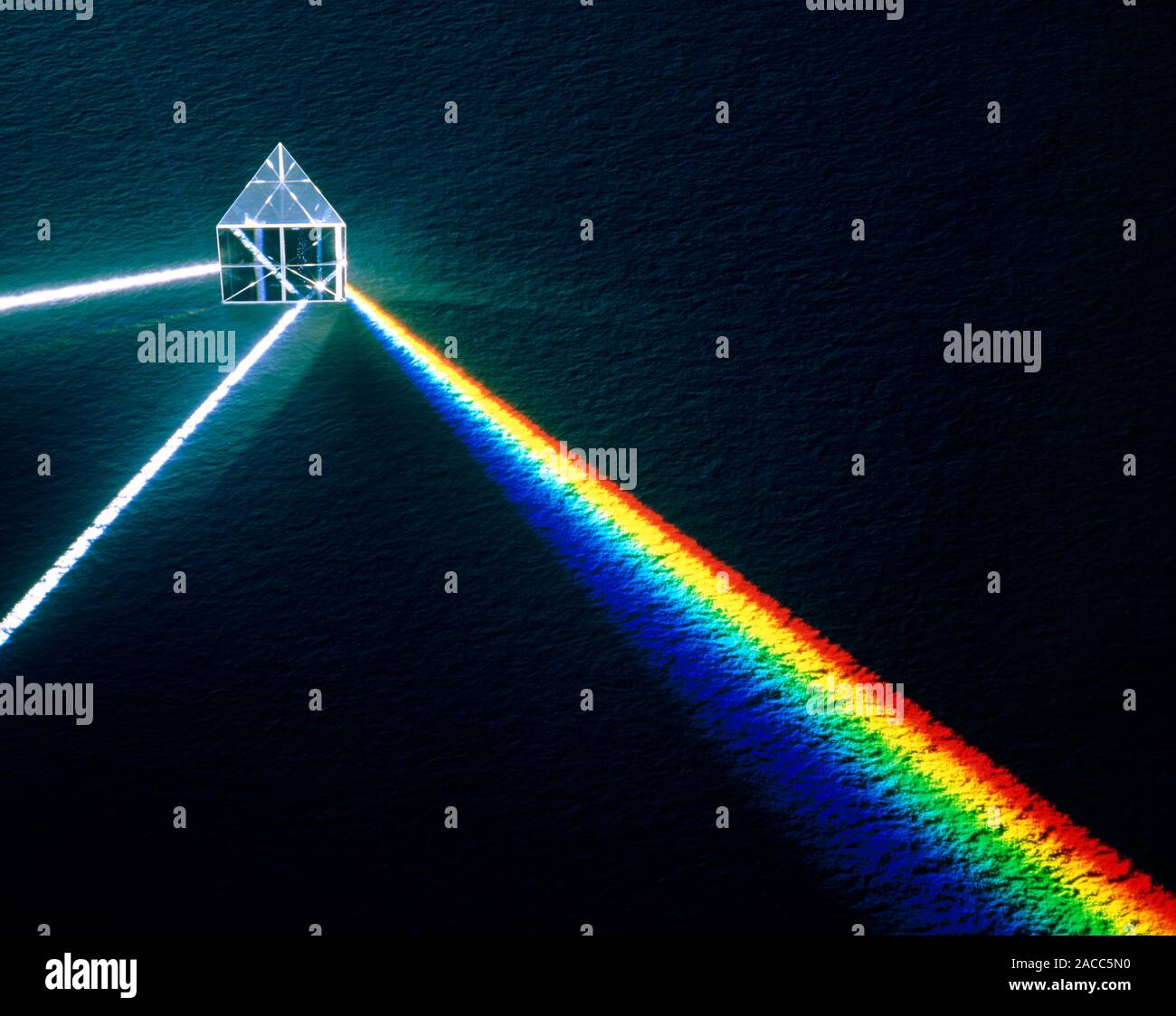 A prism demonstrating refraction and reflection effects. A beam of ...