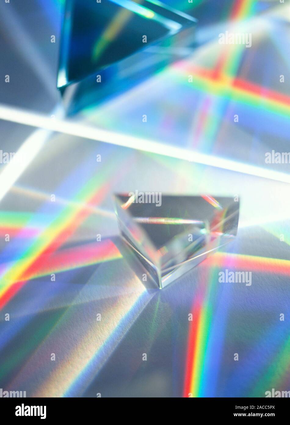 Refraction. White light being refracted as it passes through a ...