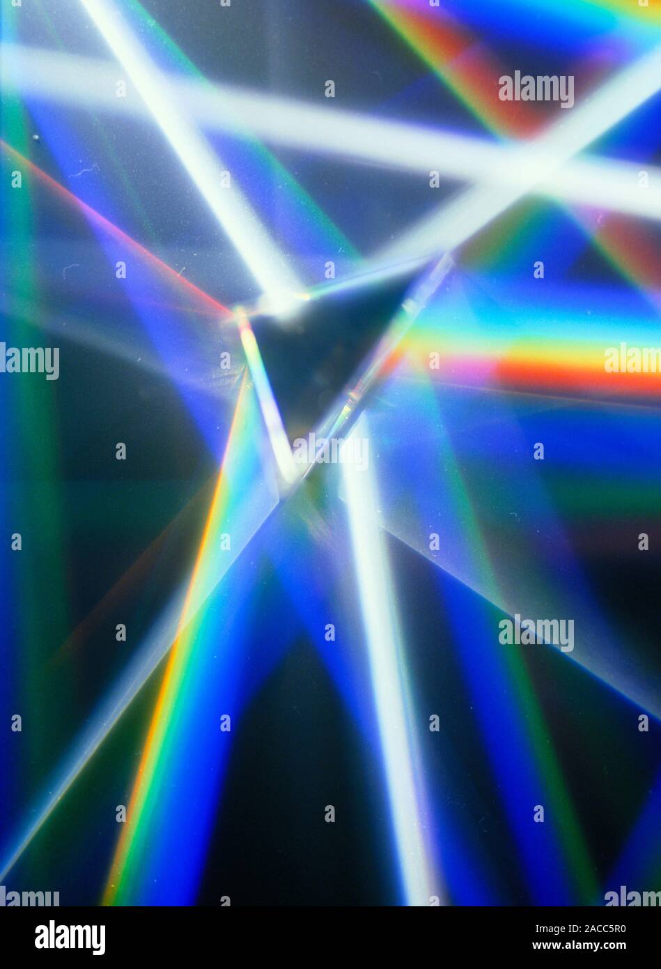 Refraction. White light being refracted as it passes through a ...