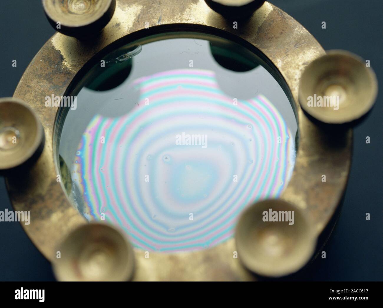 Newton's rings. Rings of colour created by white light shining on a ...