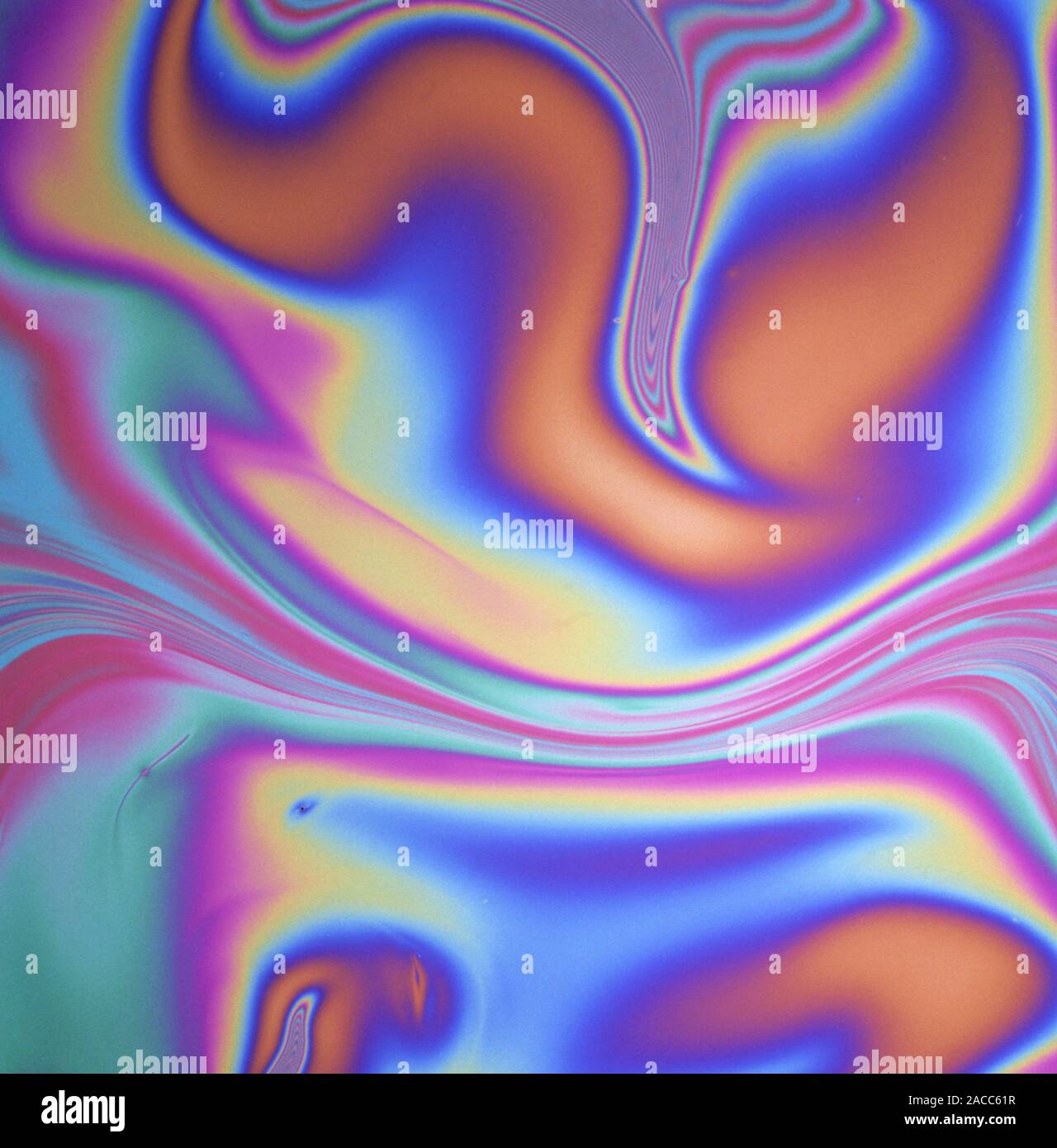 Coloured light interference pattern on a thin film of oil floating on ...