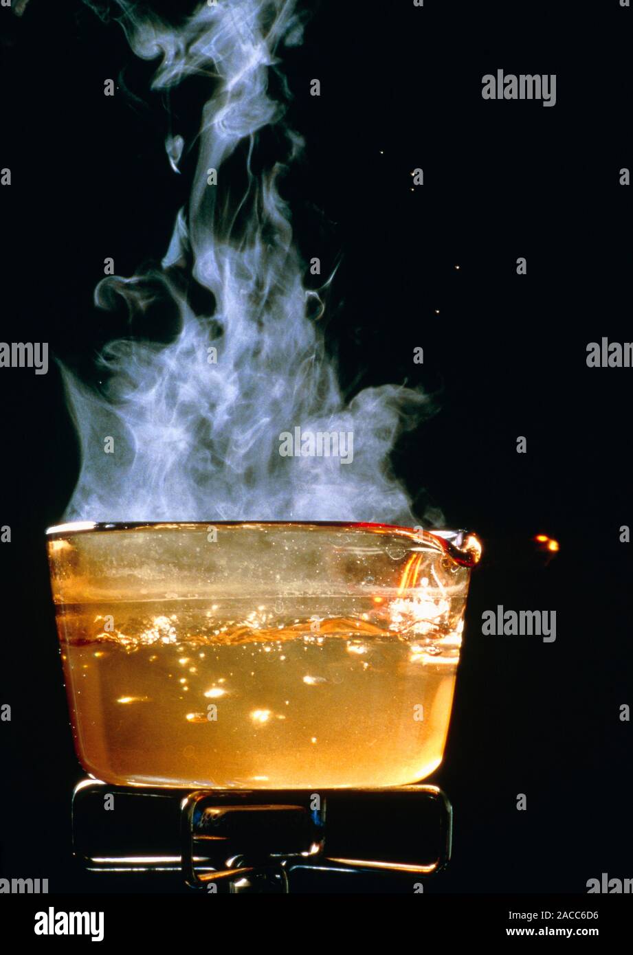 A pan of boiling water, showing air bubbles rising to the surface ...