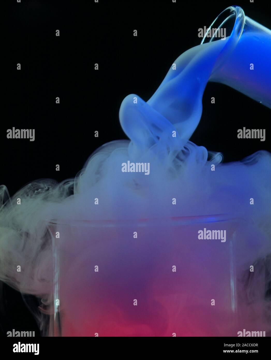 Sublimation of dry ice. A fog-like vapour spills out of a test tube ...