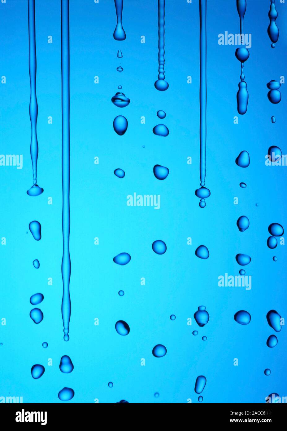 Water droplets falling in trails. High-speed photograph Stock Photo - Alamy