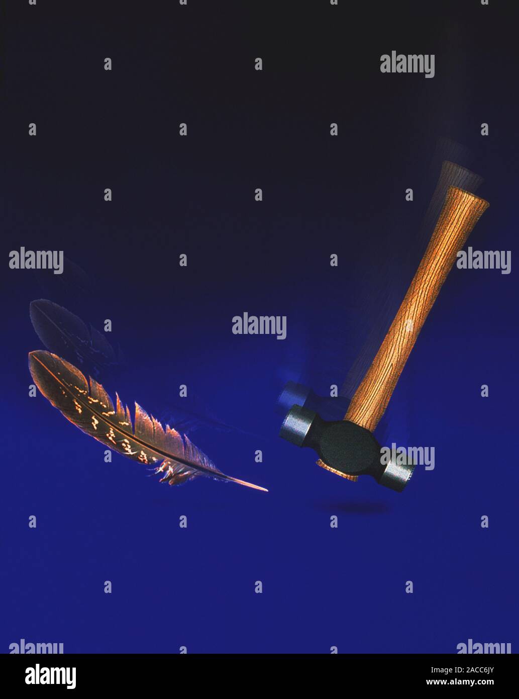 Gravity. Computer graphics image of a hammer and a feather falling together, illustrating the ...