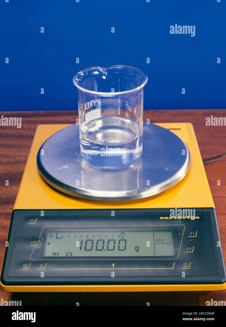 Water in beaker on scales, image 1 of 3. The scales, also known as a ...