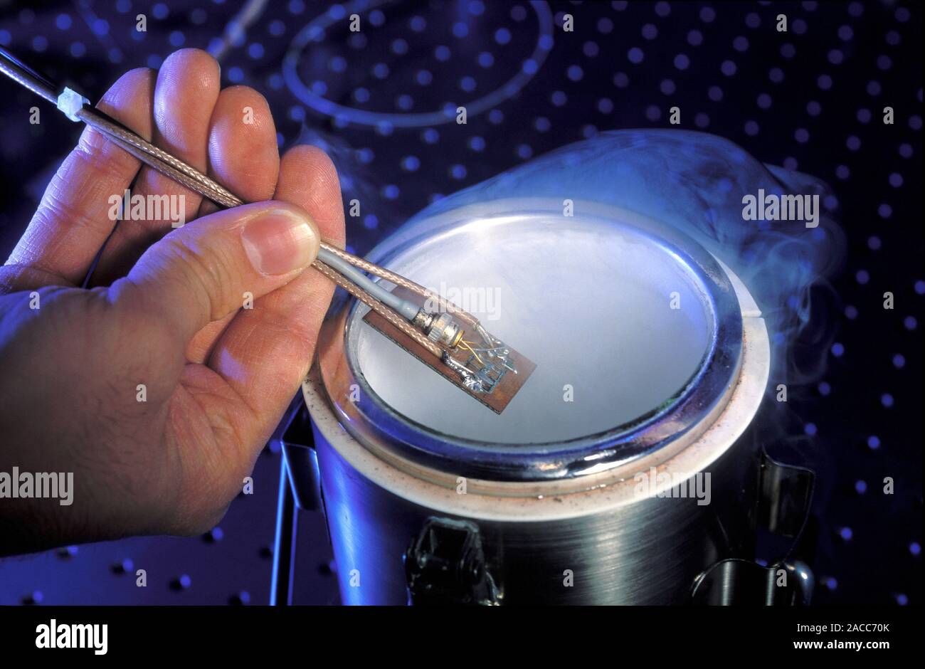 Quantum entanglement experiment. Photon detector being placed in liquid ...