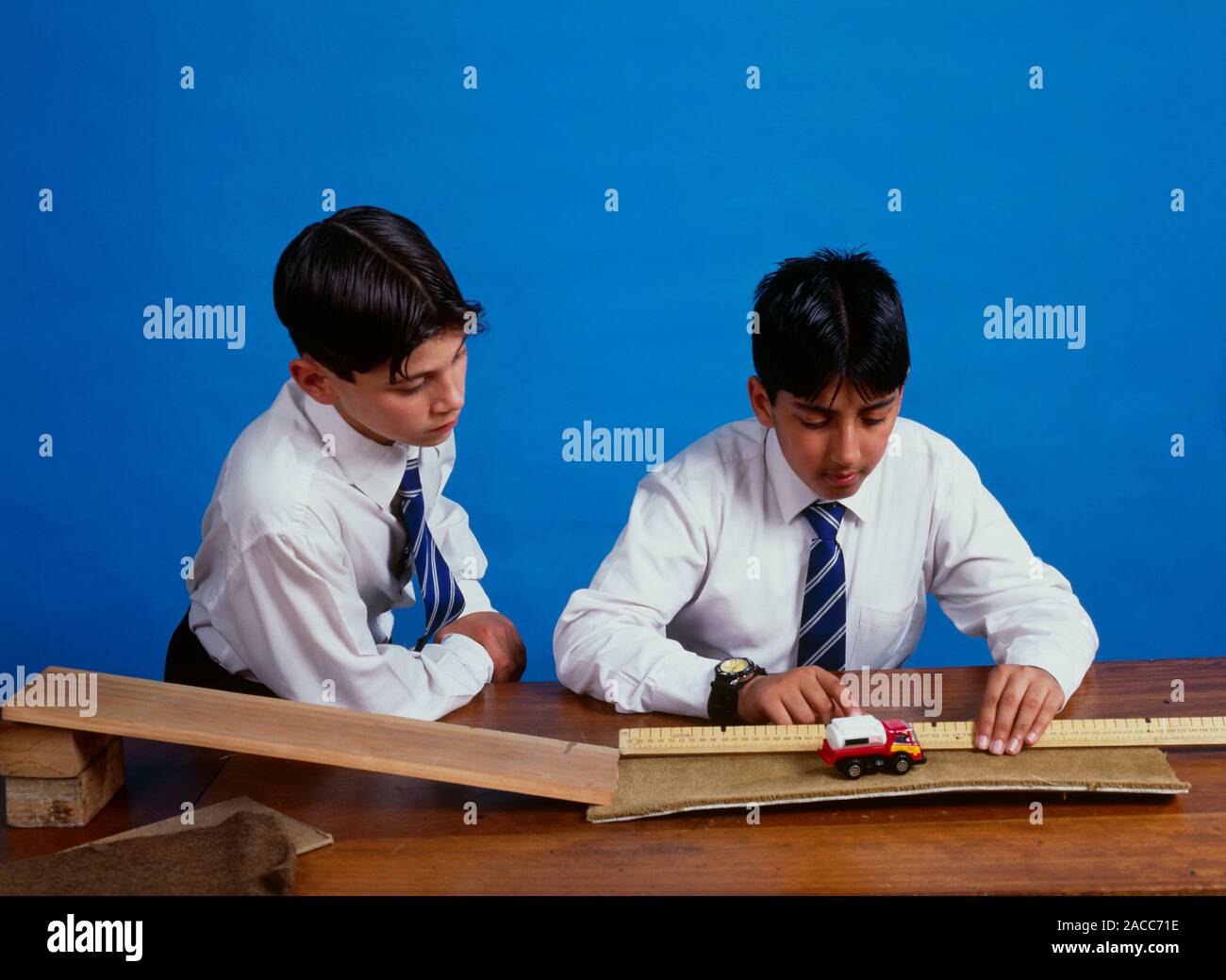 MODEL RELEASED. Measuring stopping distance. Two pupils have released a ...