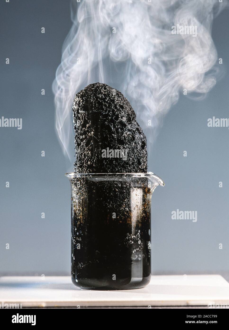 Dehydrated sucrose. Steam rising from household sugar (sucrose) that ...