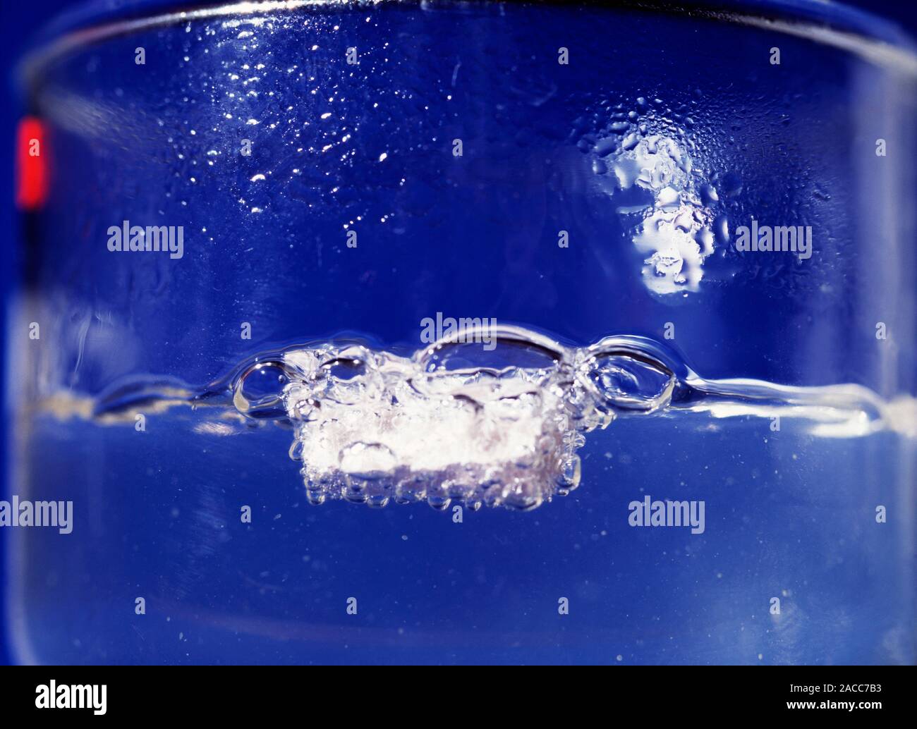 Sodium reacting with water. Chemical reaction between sodium (Na) metal ...