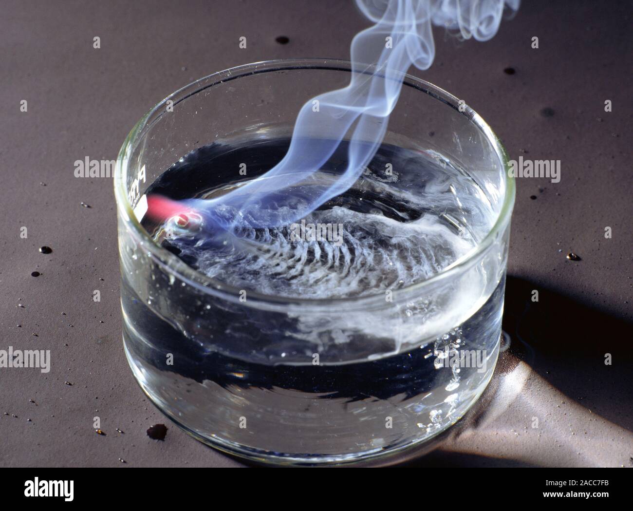 Potassium reacting with water in a water bath. Potassium (symbol K) is a highly reactive ...