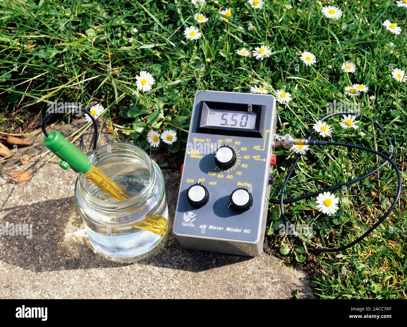 Measuring acidity of rainwater. Electronic pH meter being used to ...