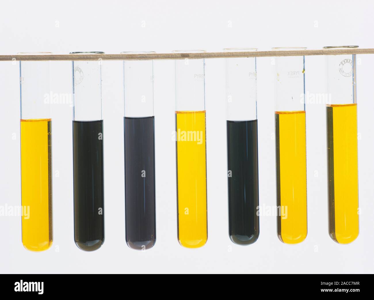 Reduction of potassium dichromate. Seven test tubes all containing ...
